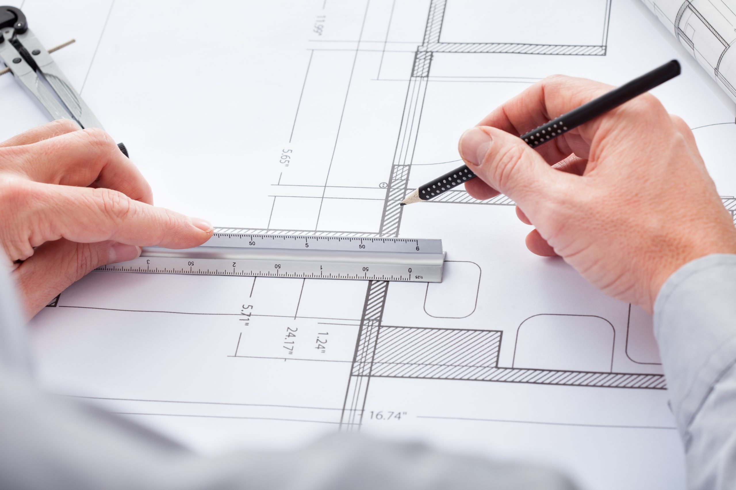 Architect Drawing On Blueprint – CURE Home